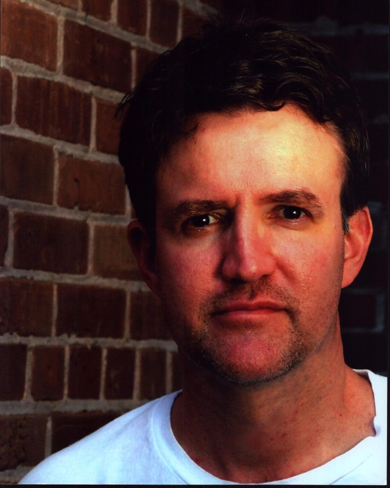 Joe Chrest In Front Of Brick Wall Photo Print (8 x 10) - Posterazzi