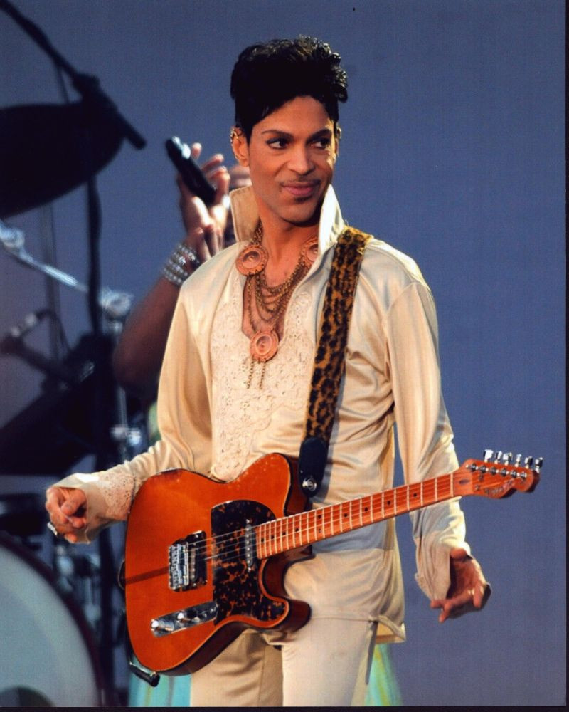 Prince In Tan Outfit Smiling Photo Print (8 x 10) - Posterazzi