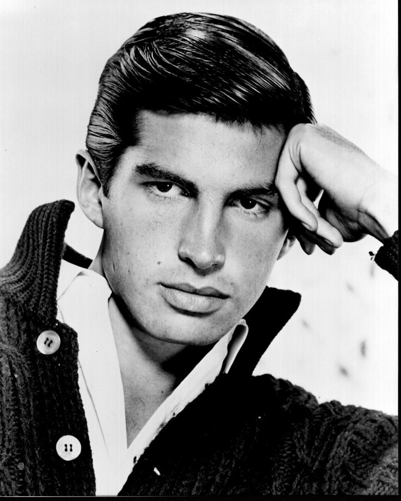 George Hamilton Headshot In Sweater With Head On Fist Black And White ...