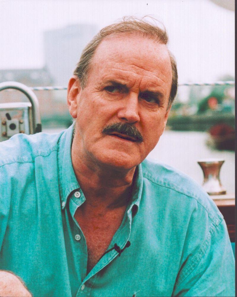 John Cleese In Blue Button Down Photo Print - Item # MVM56102 - Posterazzi