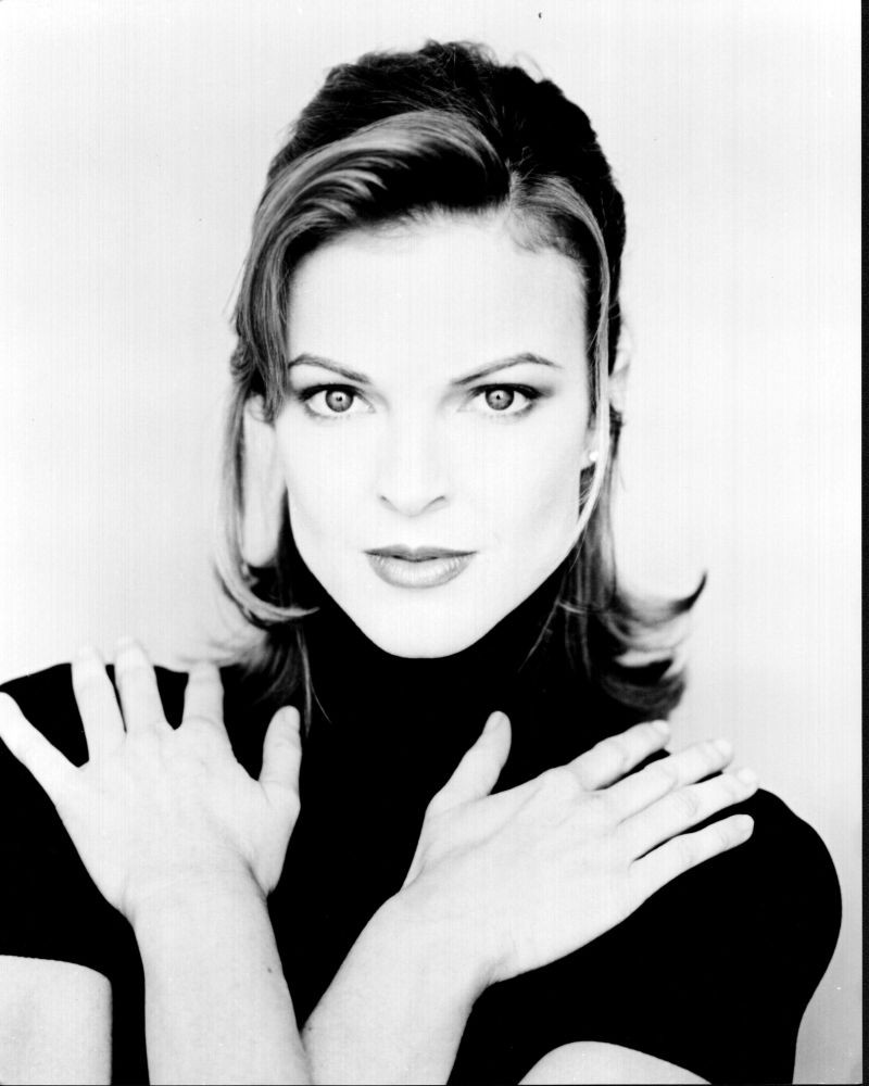 Marcia Cross Headshot In Turtleneck With Hands On Shoulders Black And ...