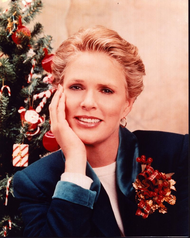 Sharon Gless In Blue Blazer With Holiday Bow In Front Of Christmas Tree ...