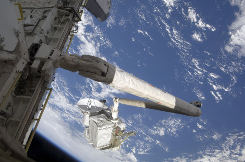 The Integrated Cargo Carrier in the grasp of the shuttle's remote ...