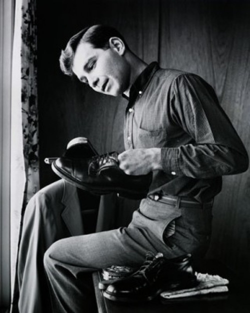 Side profile of a teenage boy polishing his shoes Poster Print - Item ...