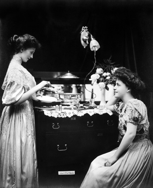 Electric Cookware, 1908. /Na Woman Serving Food From An Electric ...