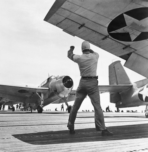 The Fighting Lady, 1944. /Na Signal Officer Directs A Fighter Plane On ...