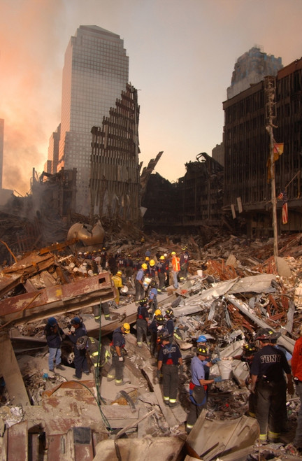 Firefighters And Search And Rescue Teams Work On 'The Pile' Of Rubble ...
