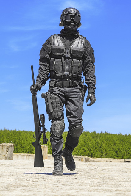 SWAT police operator with sniper rifle in black uniform, walking ...