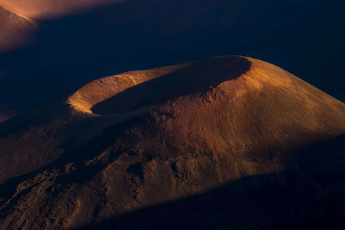 Sunlit rim of the Haleakala Crater at sunset; Kula, Maui, Hawaii ...