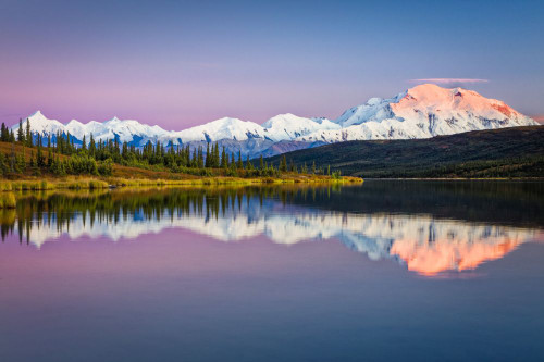 Sunset glow on Mount Denali (McKinley) reflects on Wonder Lake with ...