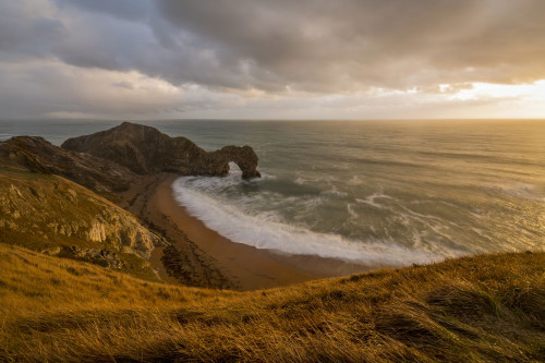 The cliff top view over Durdle Door in Dorset. Poster Print by Loop ...