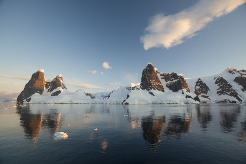 Reflections of cliffs and mountains in the Lemaire Channel; Antarctica ...