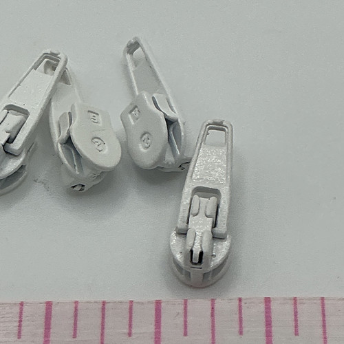 #2 COIL WHITE PULLS. Single Pull Self Locking - Fabric Warehouse