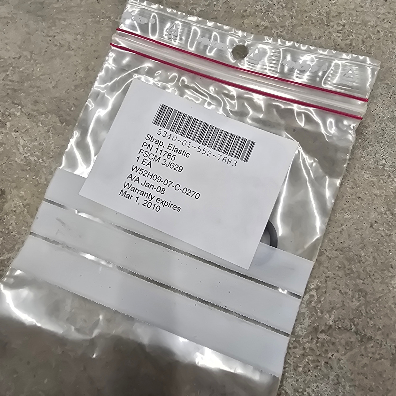 Aimpoint Adjustment Cap Retaining Strap for Comp M4