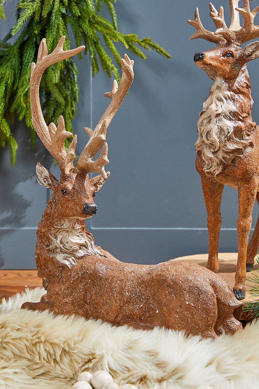 15" Resin Frosted Laying Reindeer - Decorator's Warehouse