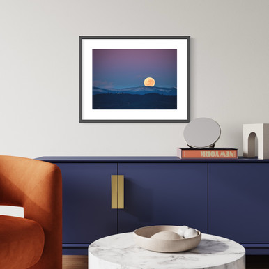 Full moon sets behind Mount Stromlo Observatory in Canberra